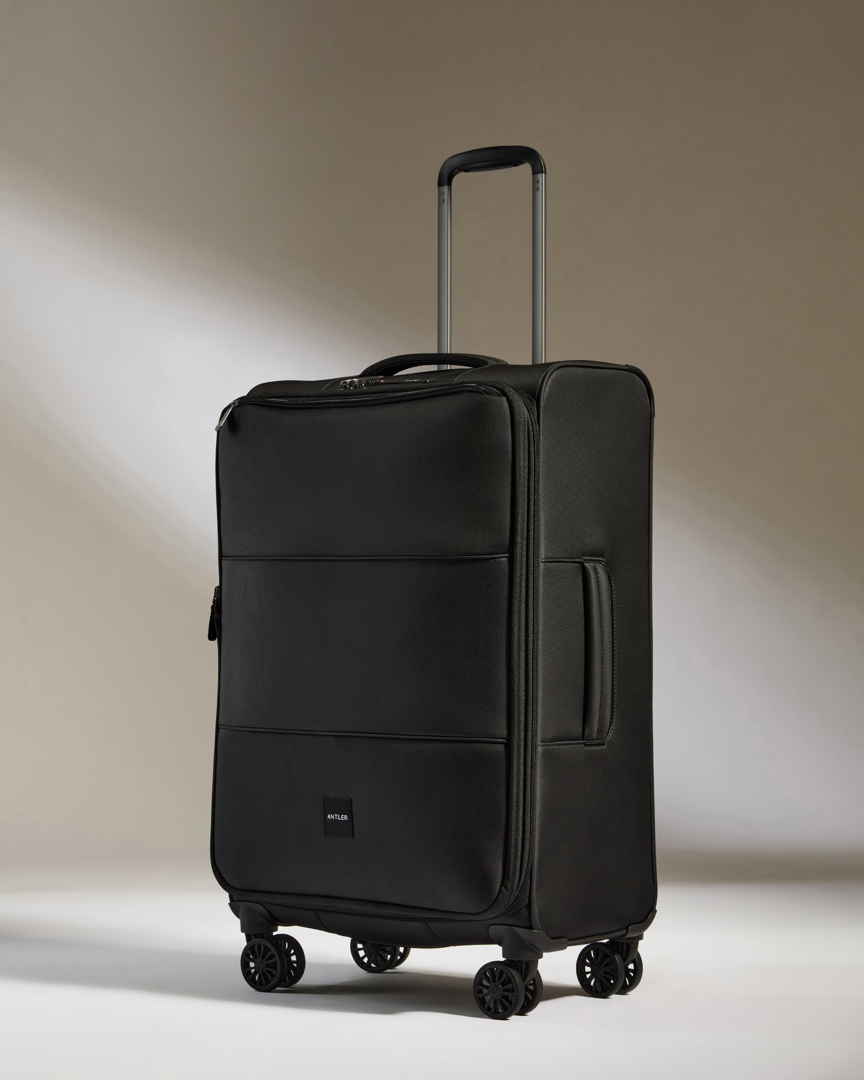 Lightest Medium Suitcase in Black - Soft Stripe | Soft Suitcase ...